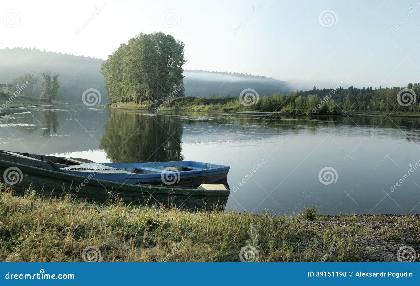Three Boats on the Shore in a Quiet Backwater Stock Photo - Image of ...