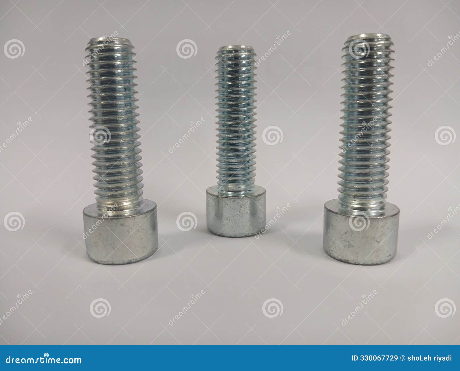 Three Bolts on the White Table Stock Image - Image of industrie, steel ...