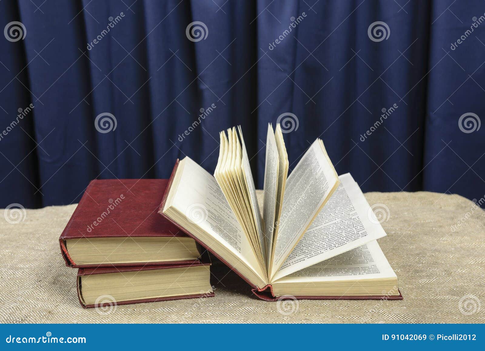 Three Books on a Blue Background. Stock Image - Image of group ...