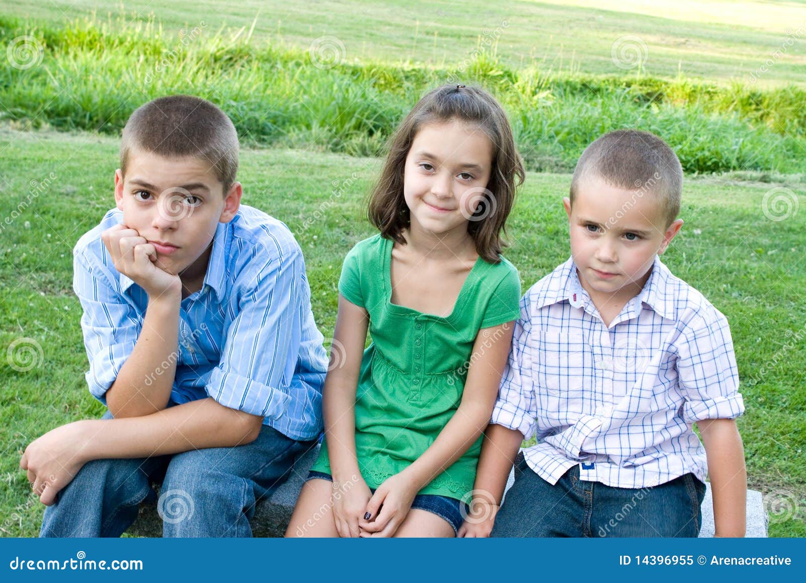Grumpy Kids Not Happy About Their New Sibling Stock Image ...