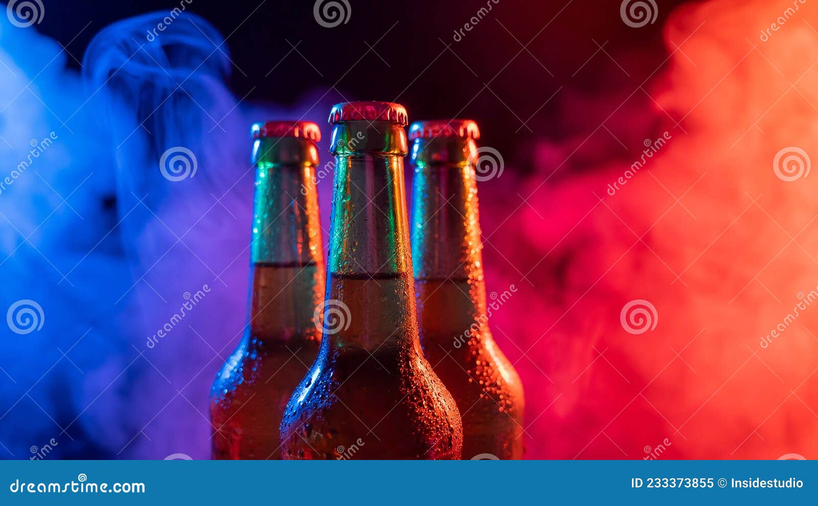 Three Bottles of Beer in a Blue-pink Mist. Stock Image - Image of ...