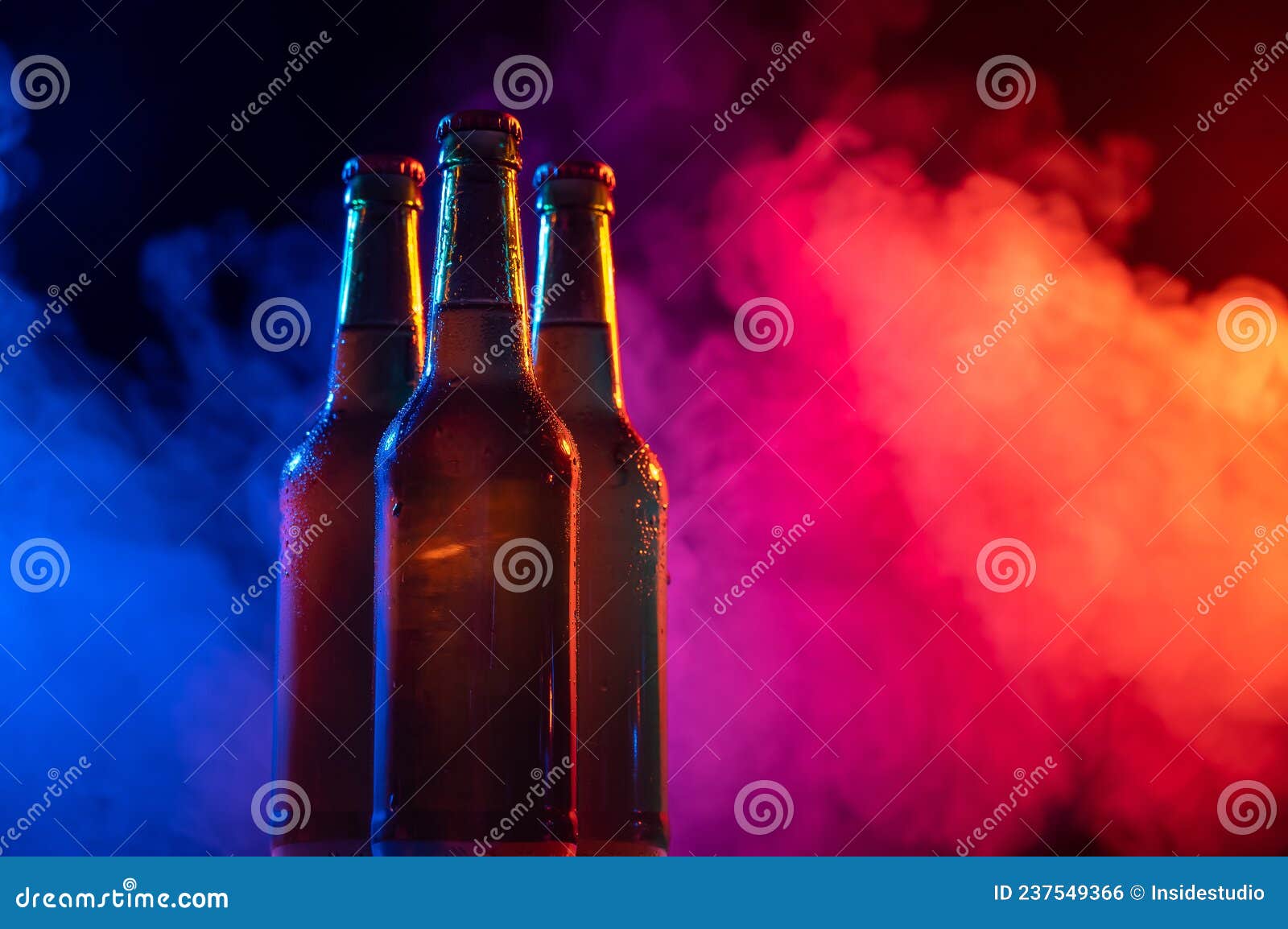 Three Bottles of Beer in a Blue-pink Mist. Stock Photo - Image of blue ...