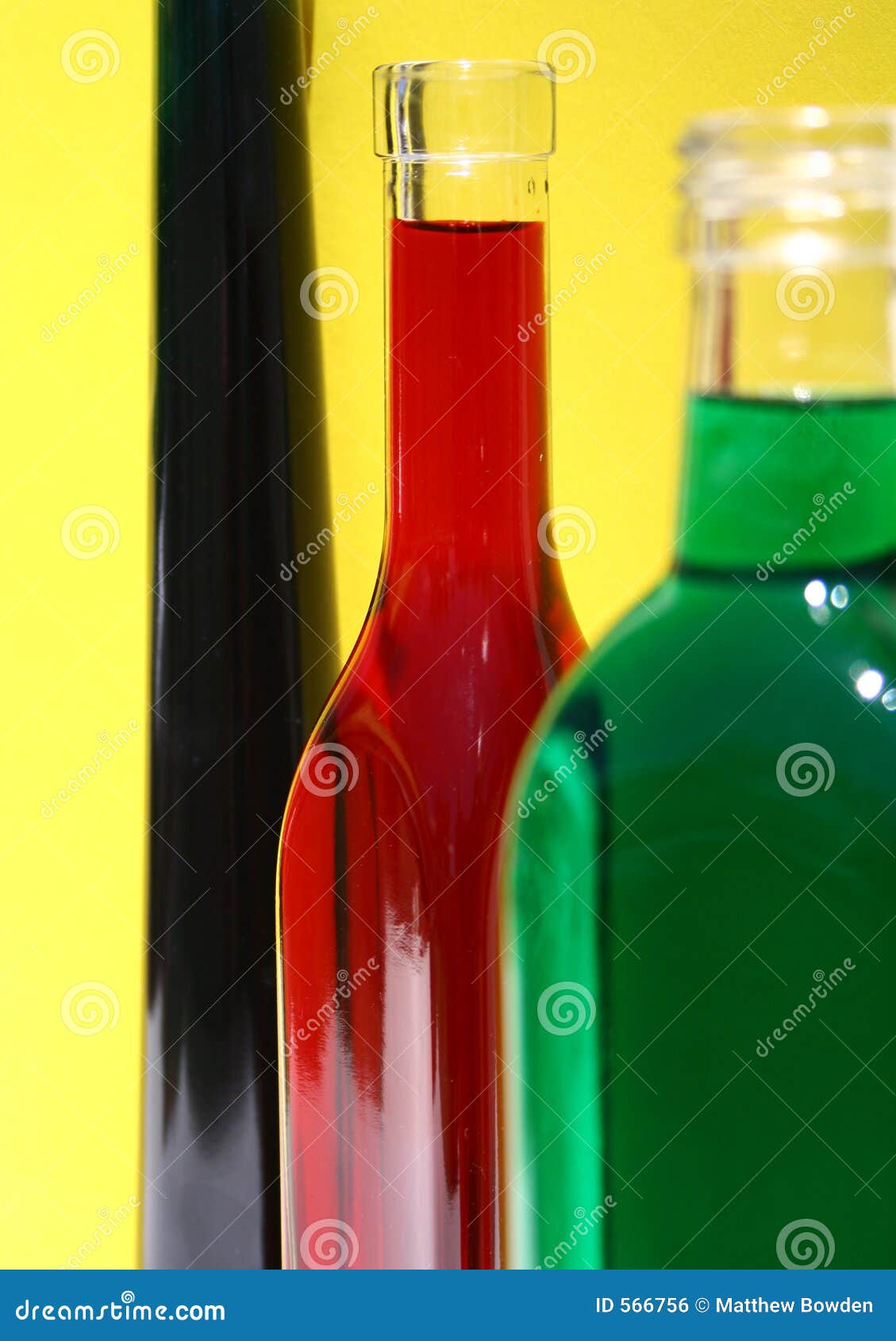 Three Bottles of Colour stock photo. Image of liquid, bottle - 566756