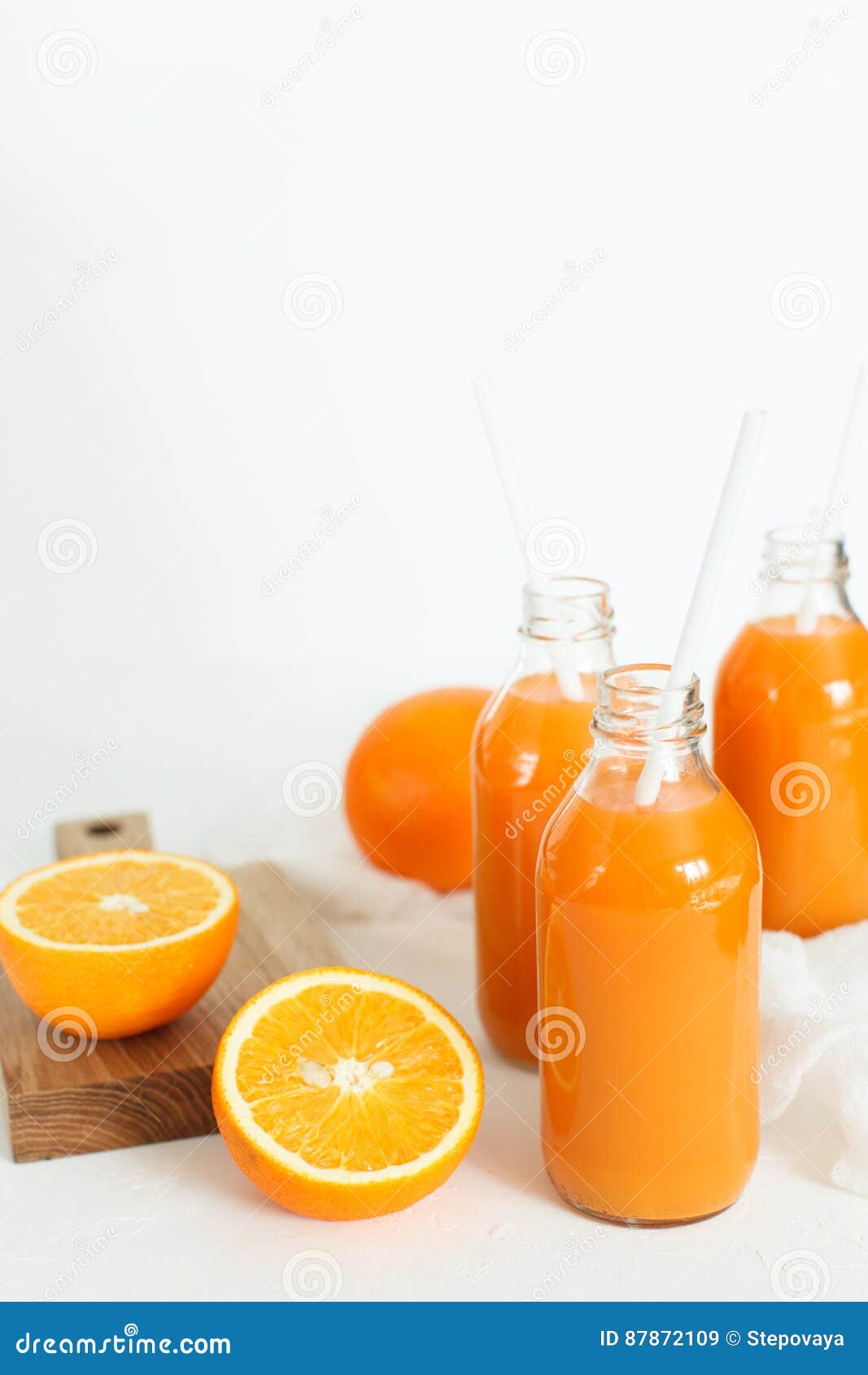 Three Bottles of Orange Juice and Tubes are on the Table Stock Image ...