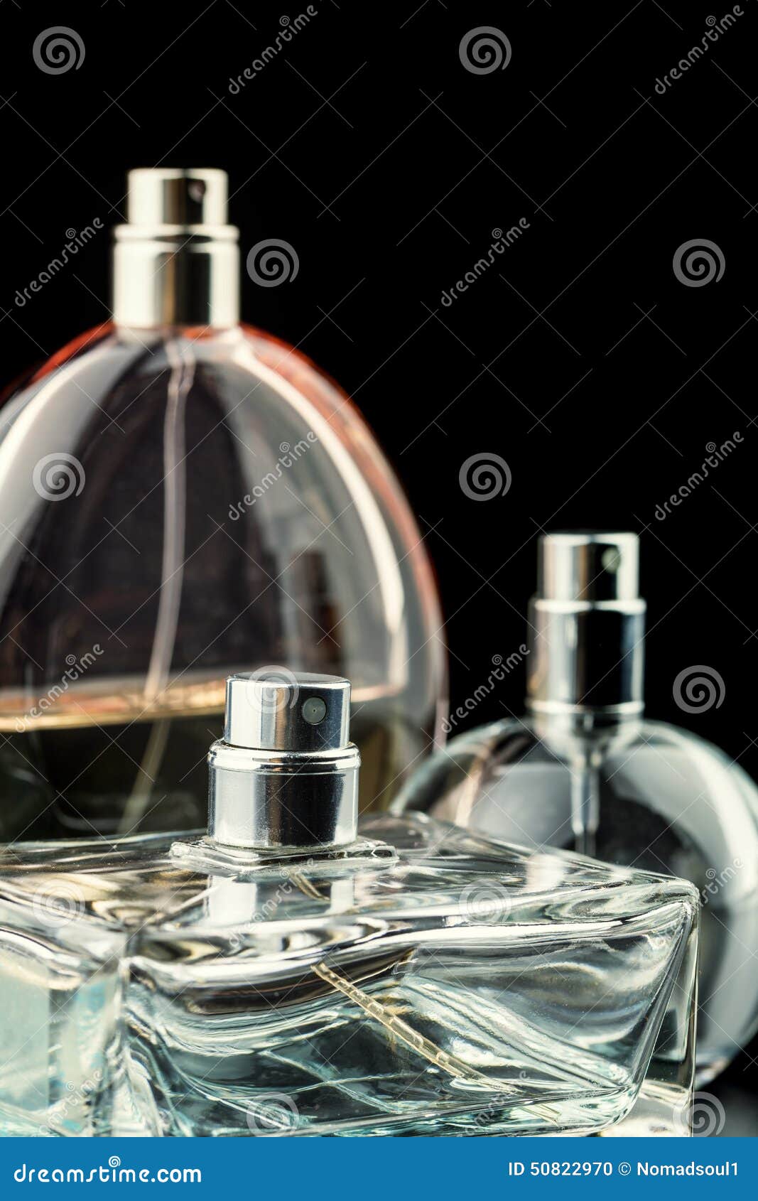 Three bottles of perfumes stock photo. Image of gift - 50822970