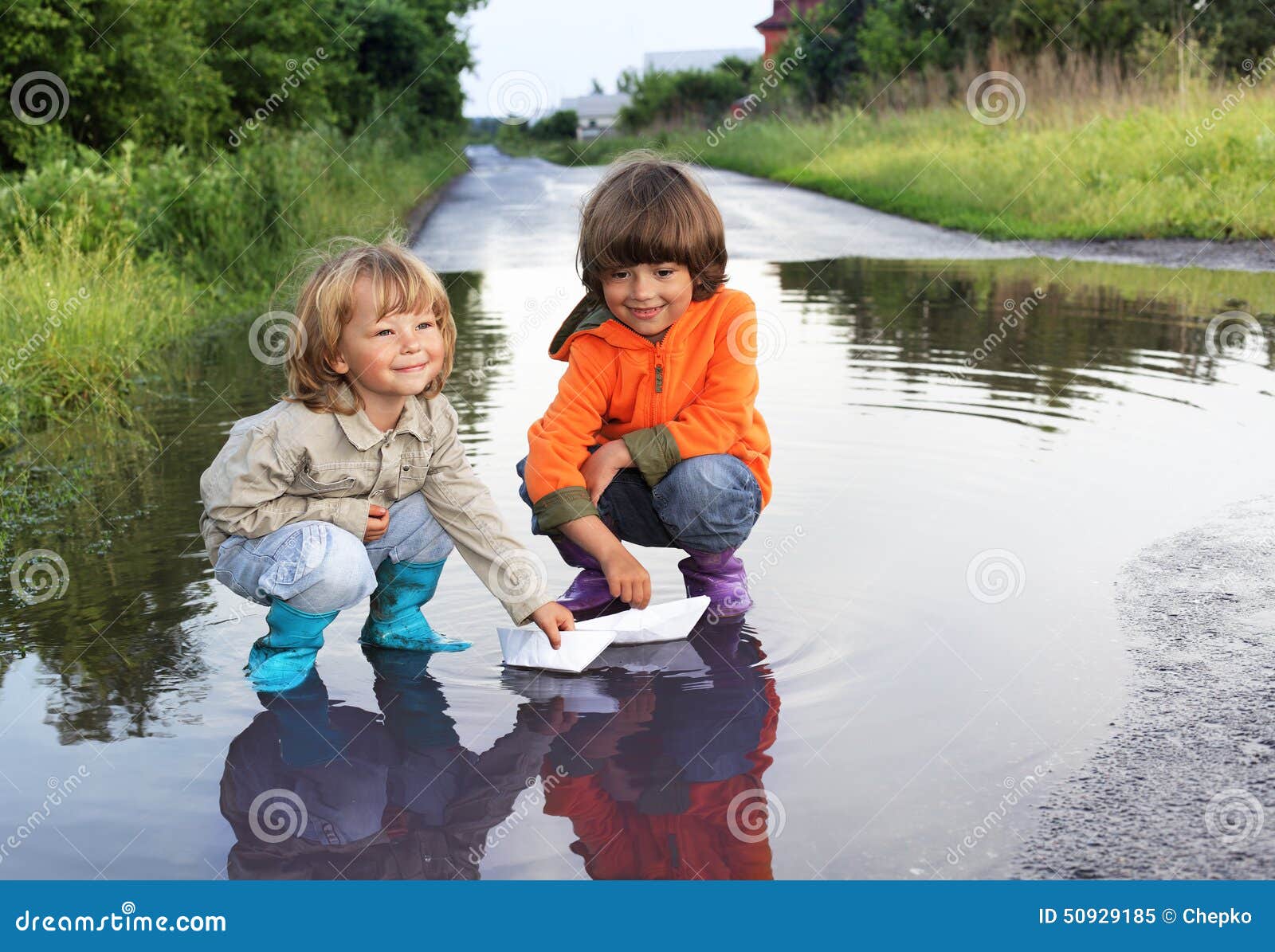 Three boy play in puddle stock image. Image of color - 50929185