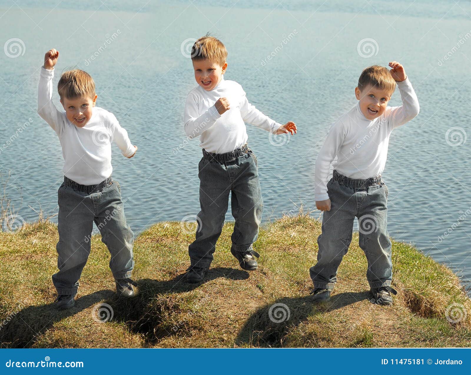 Three Boys Dance on Green Grass Stock Image - Image of nature, clouds ...