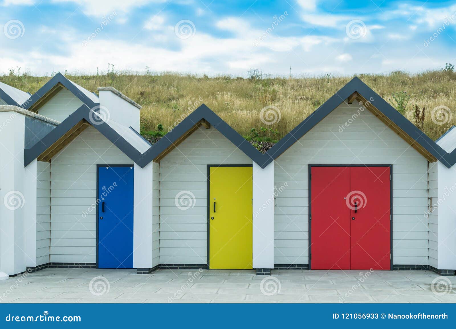 Three Brightly Coloured Beach Huts at Swanage in Dorset Stock Image ...