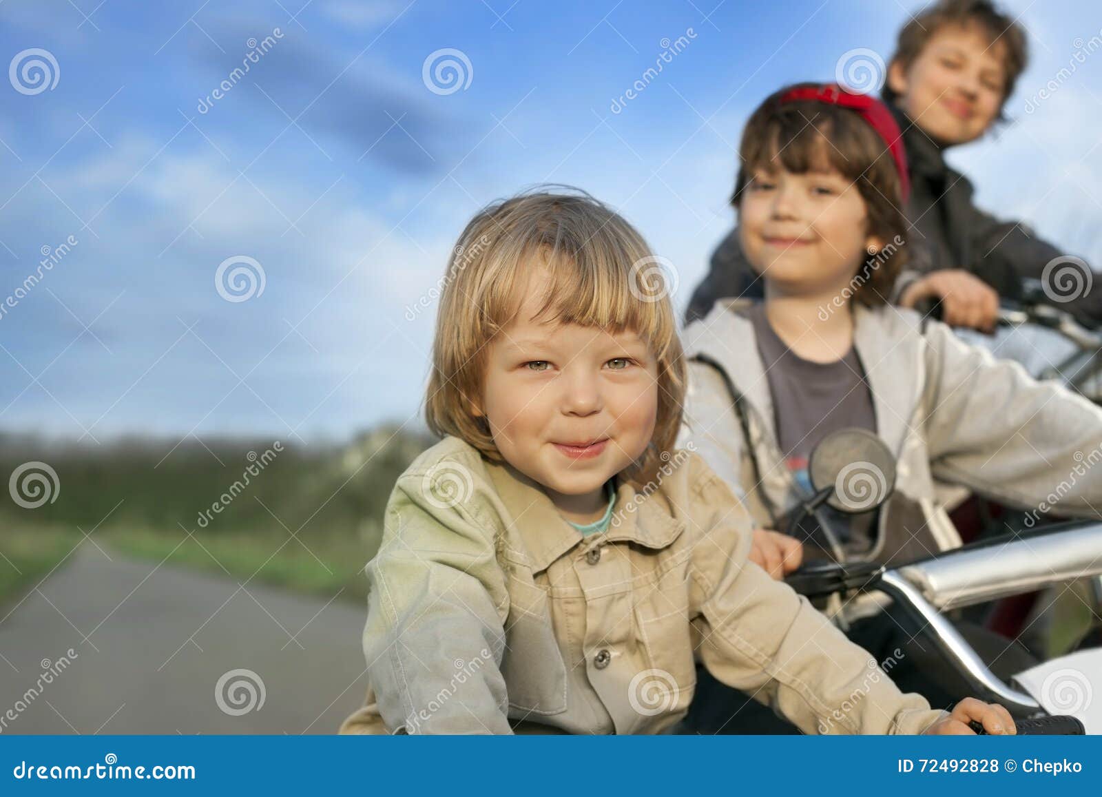 Three brothers ride bikes stock photo. Image of park - 72492828