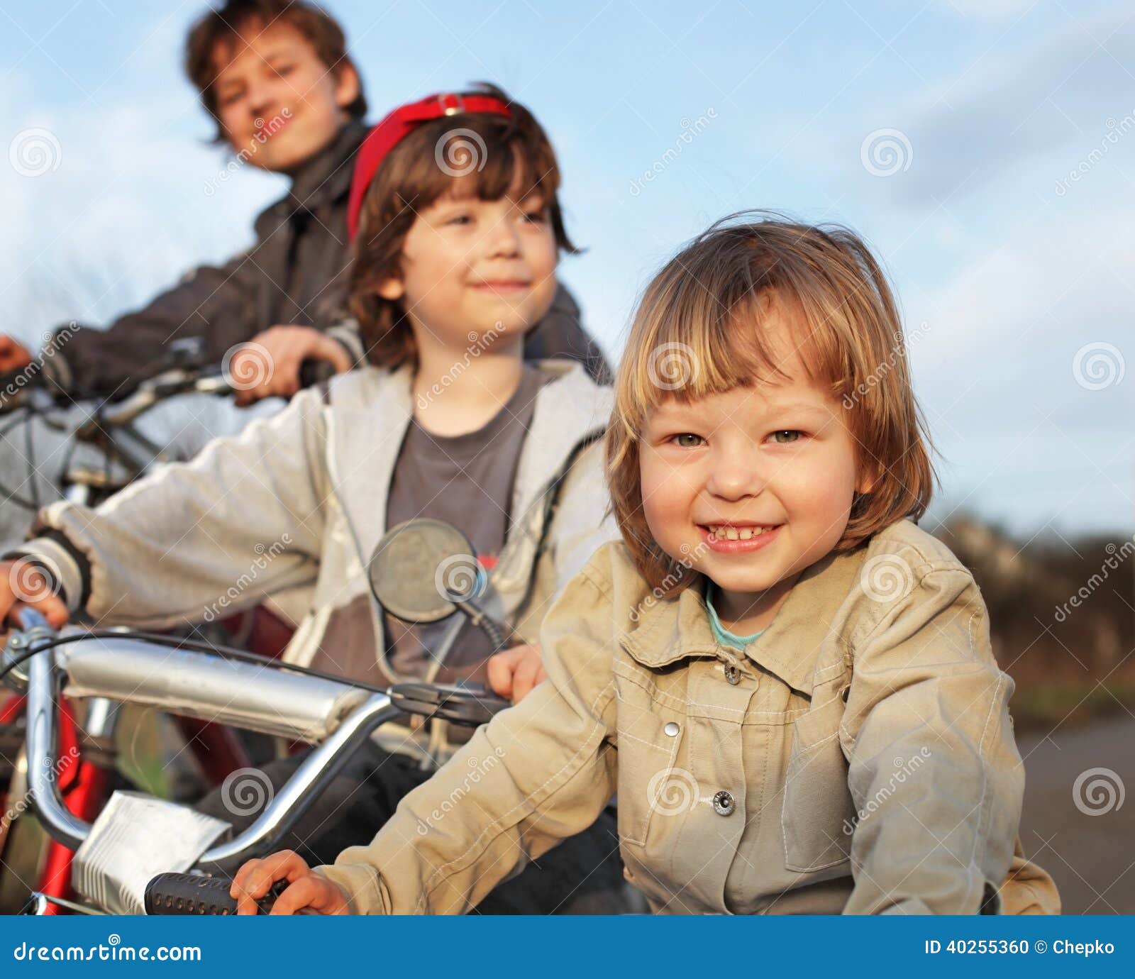 Three brothers ride bikes stock photo. Image of boys - 40255360