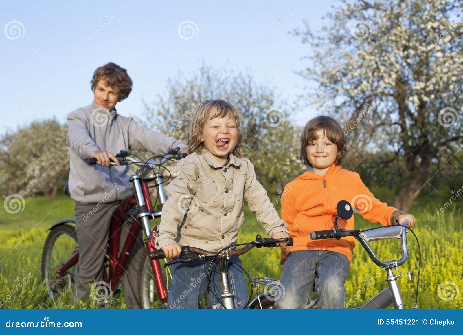 Three brothers ride bikes stock image. Image of parent - 55451221
