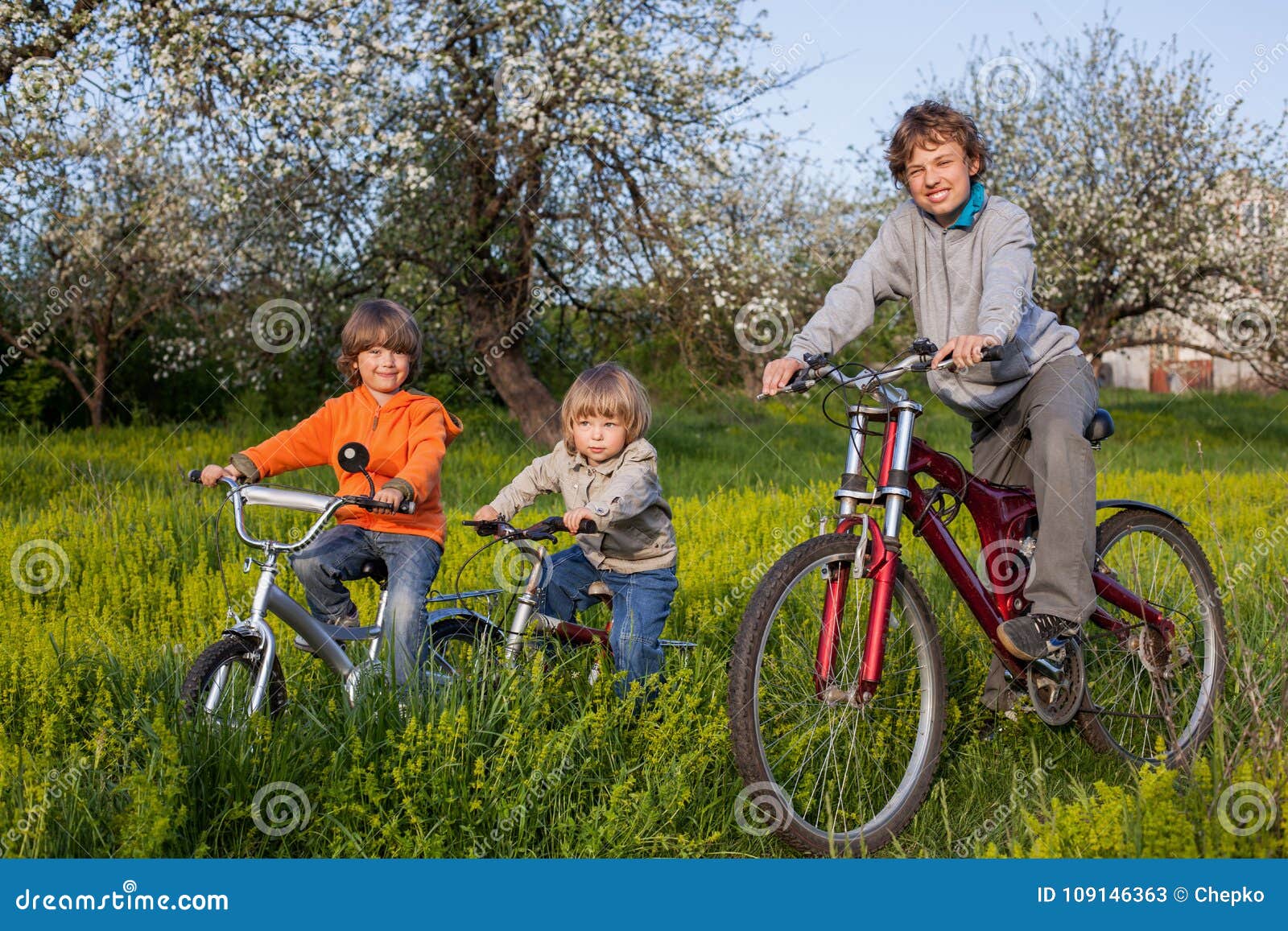 Three brothers ride bikes stock image. Image of nature - 109146363