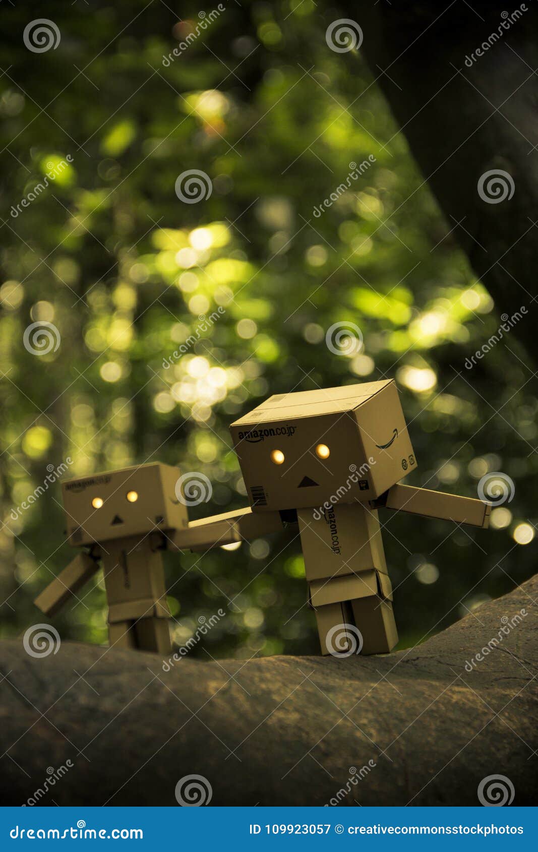 Three Brown Cardboard Box Figures On Brown Surface Picture. Image ...