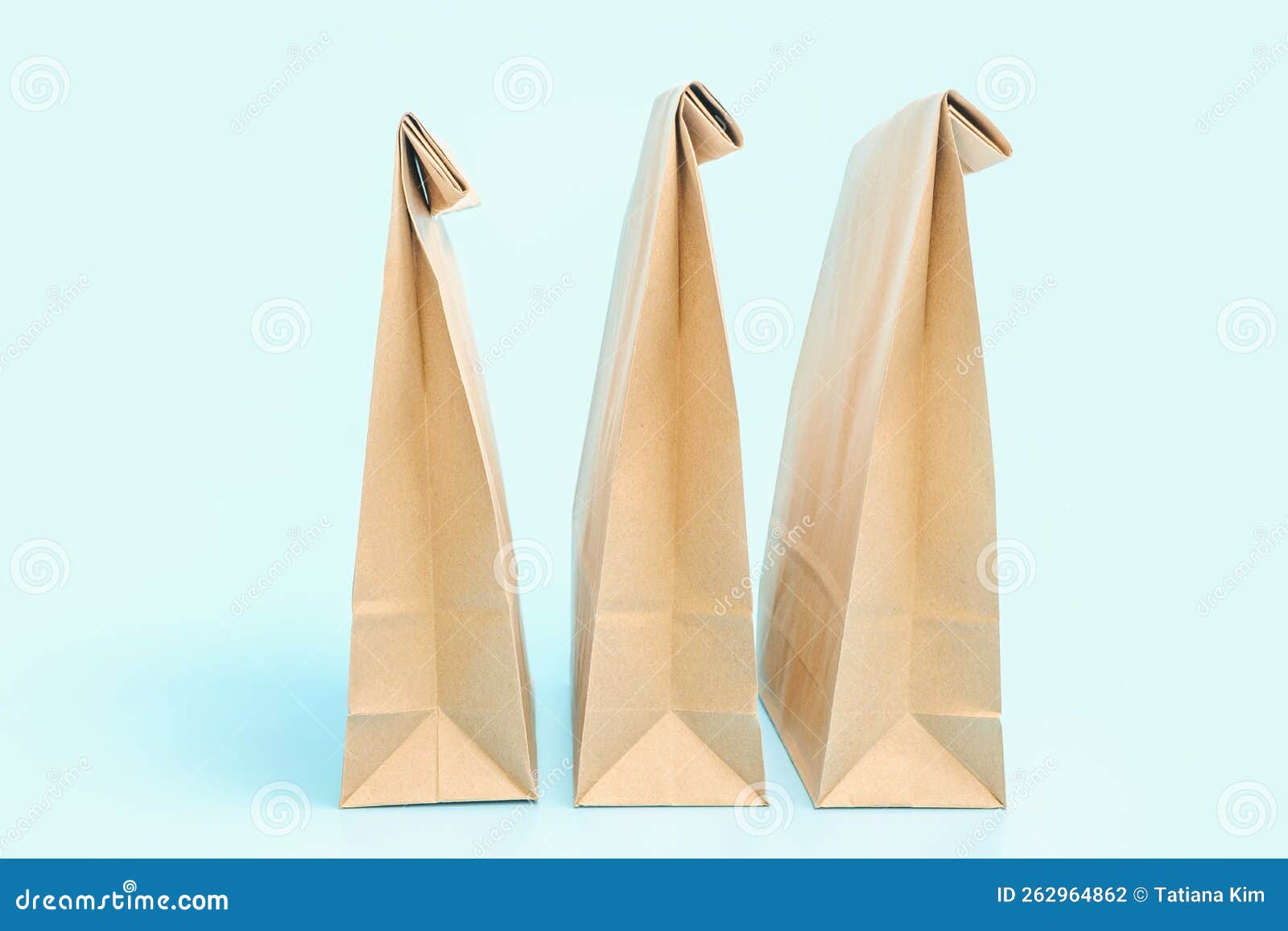 Three Brown Paper Bags on Blue Background Side View. Stock Photo ...