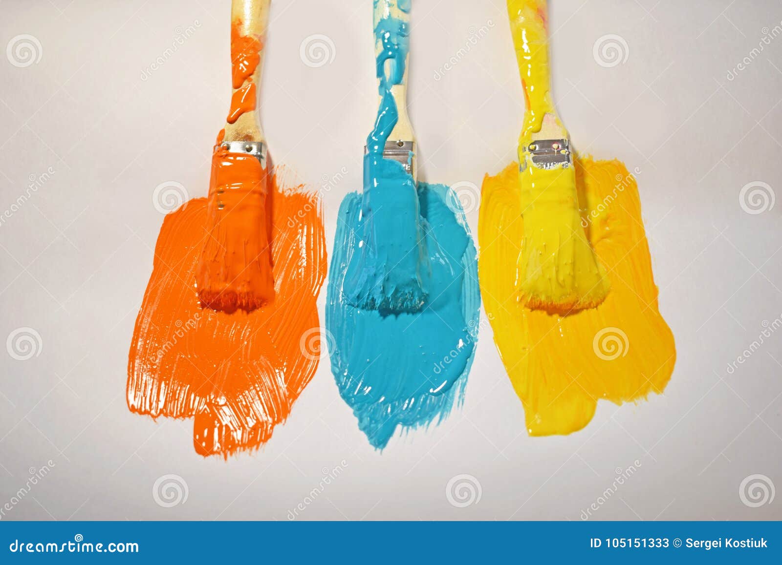 Three brushes in paint stock image. Image of background - 105151333