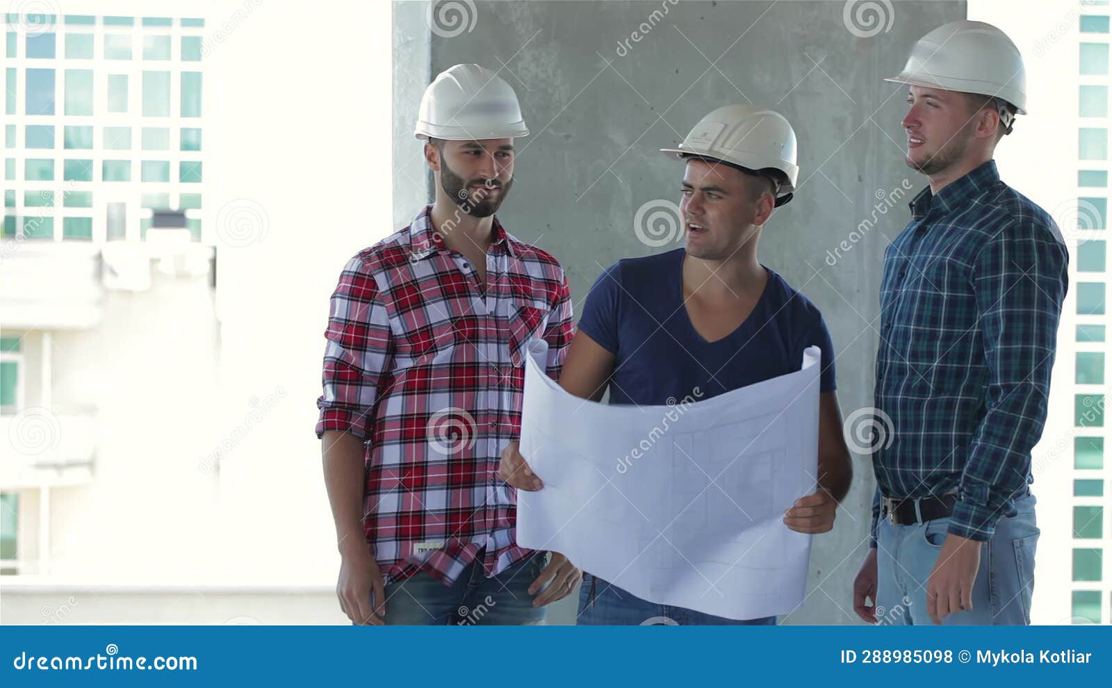 Three Builders Pose at the Building Under Construction Stock Footage ...