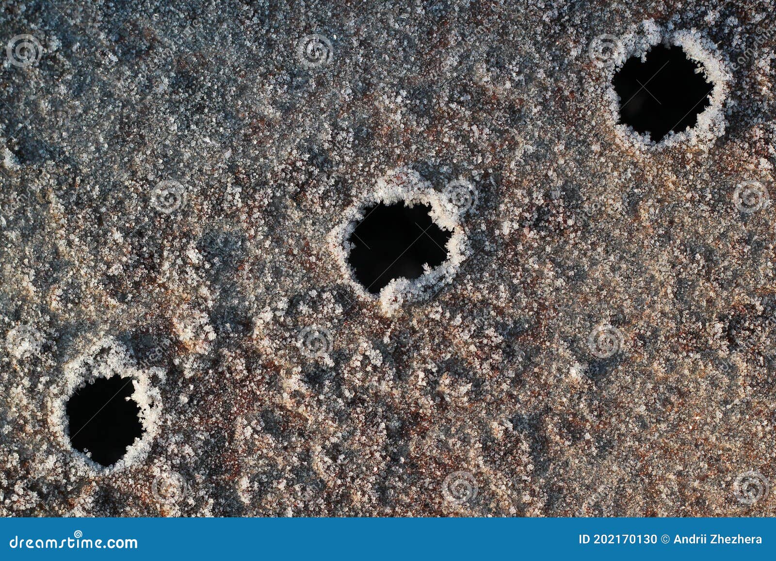 Three Bullet Holes in a Metal Plate Covered with Snow Stock Photo ...