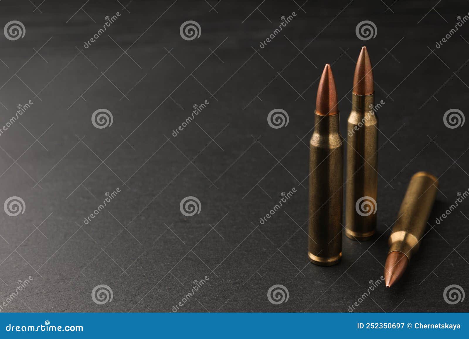 Three Bullets Bottom Against Blurred Kalashnikov Assault Rifle ...
