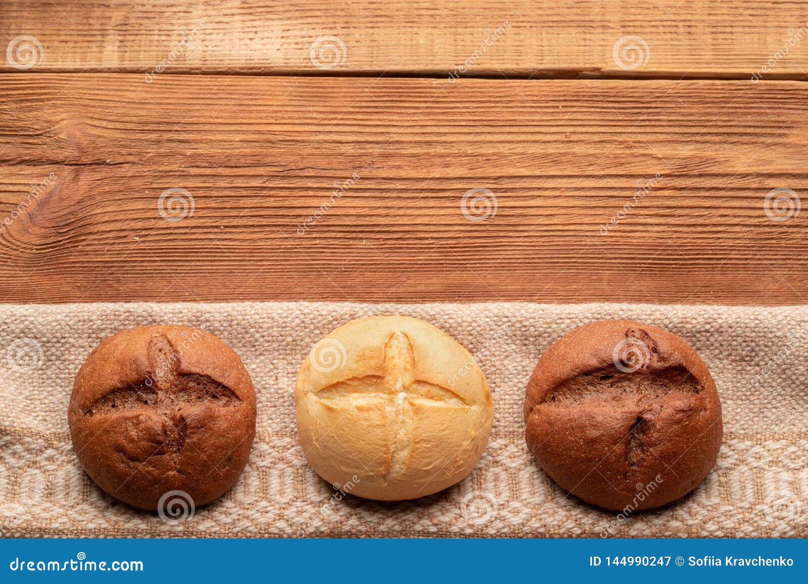 Three buns on wooden table stock image. Image of buns - 144990247