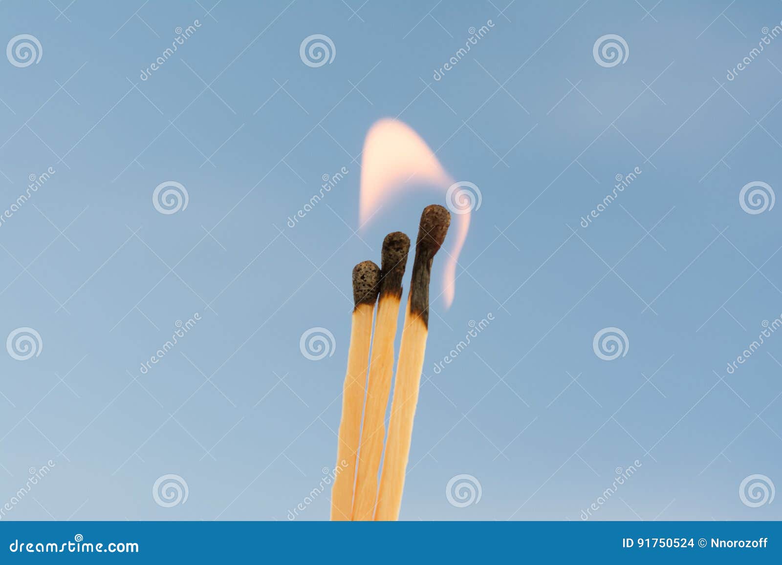 Three Burning Matches on a Blue Background Stock Photo - Image of head ...