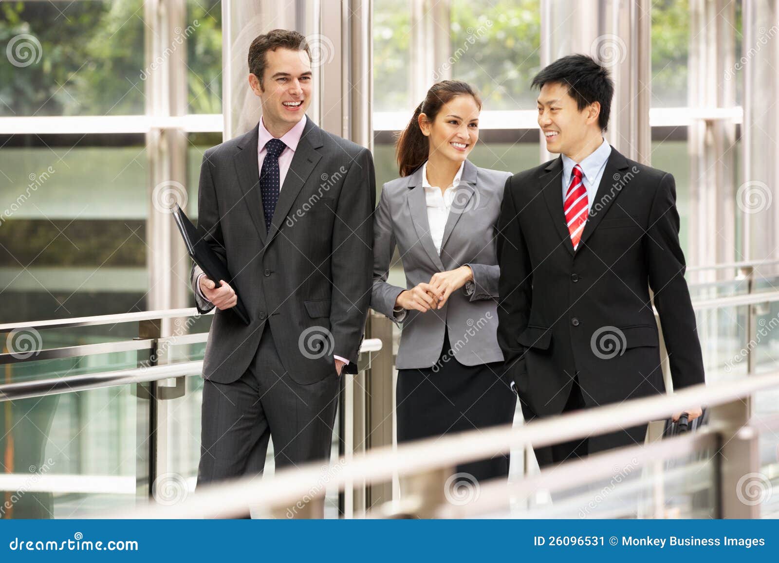 Three Business Colleagues Chatting Walking Stock Image - Image of kong ...