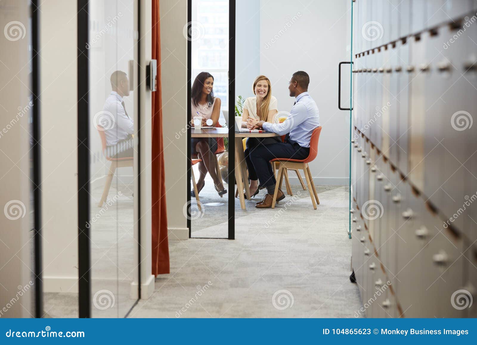 Three Business Colleagues at an Informal Office Meeting Stock Image ...