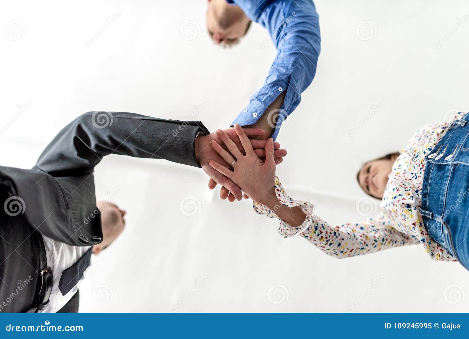 Three Business Colleagues Stacking Hands Stock Image - Image of hands ...