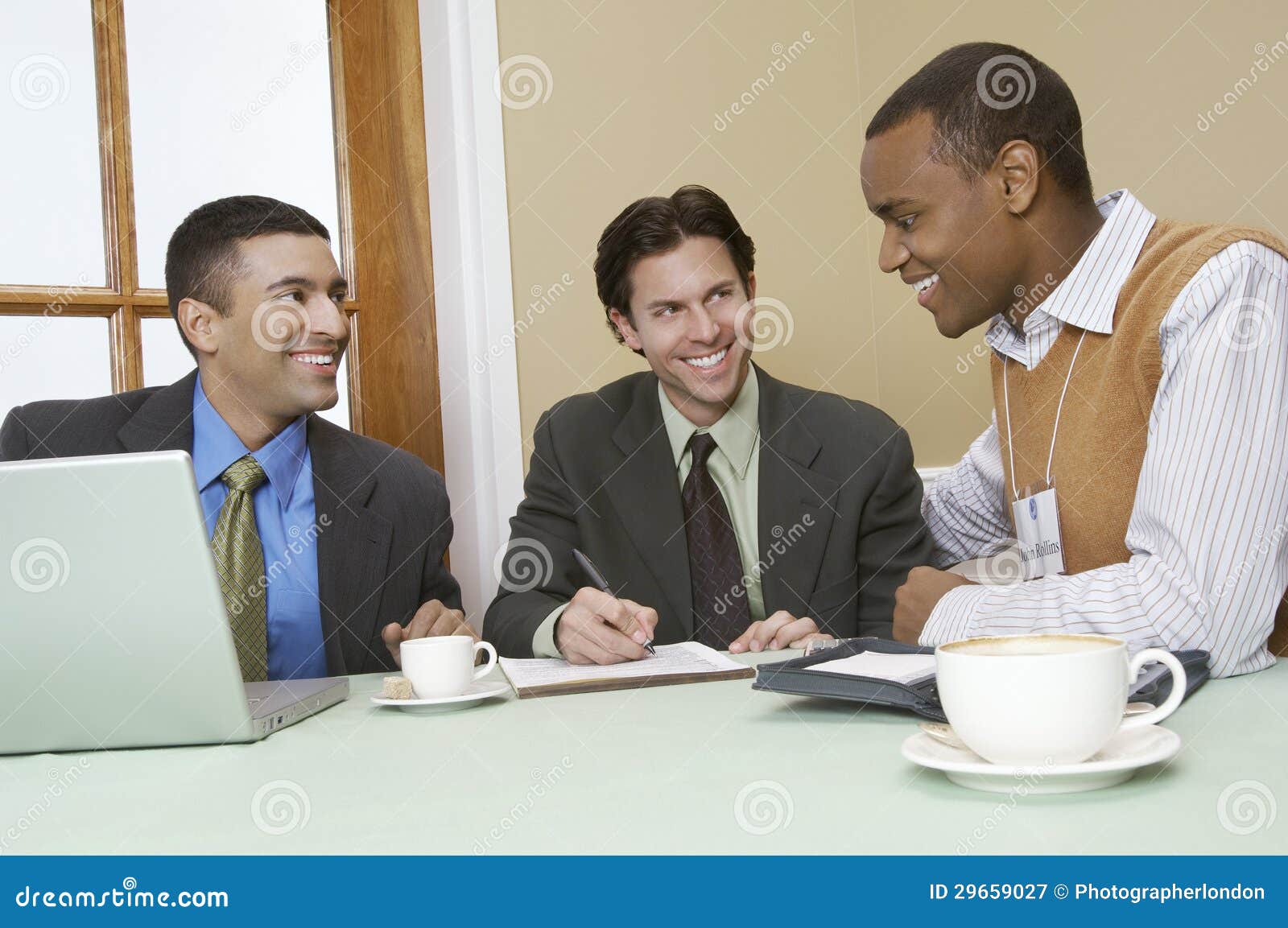 Three Business Men Discussing at Desk Stock Image - Image of cheerful ...