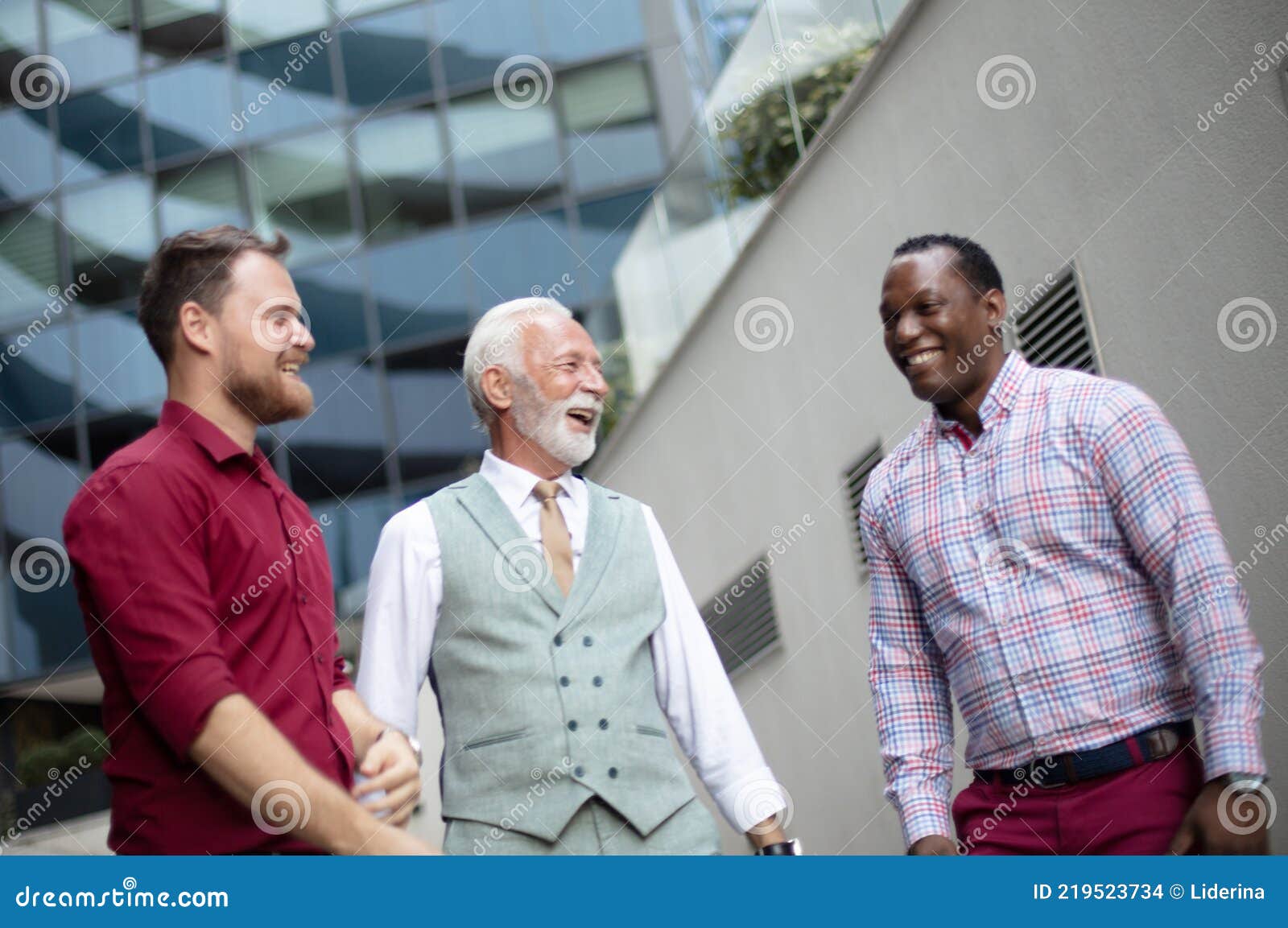 Three business men talking stock photo. Image of ethnicity - 219523734