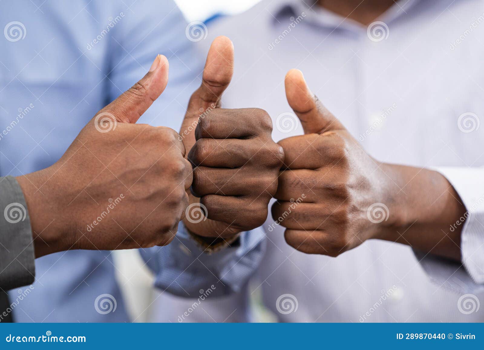 Three Business Partners Keeping Thumbs Up Stock Photo - Image of ...