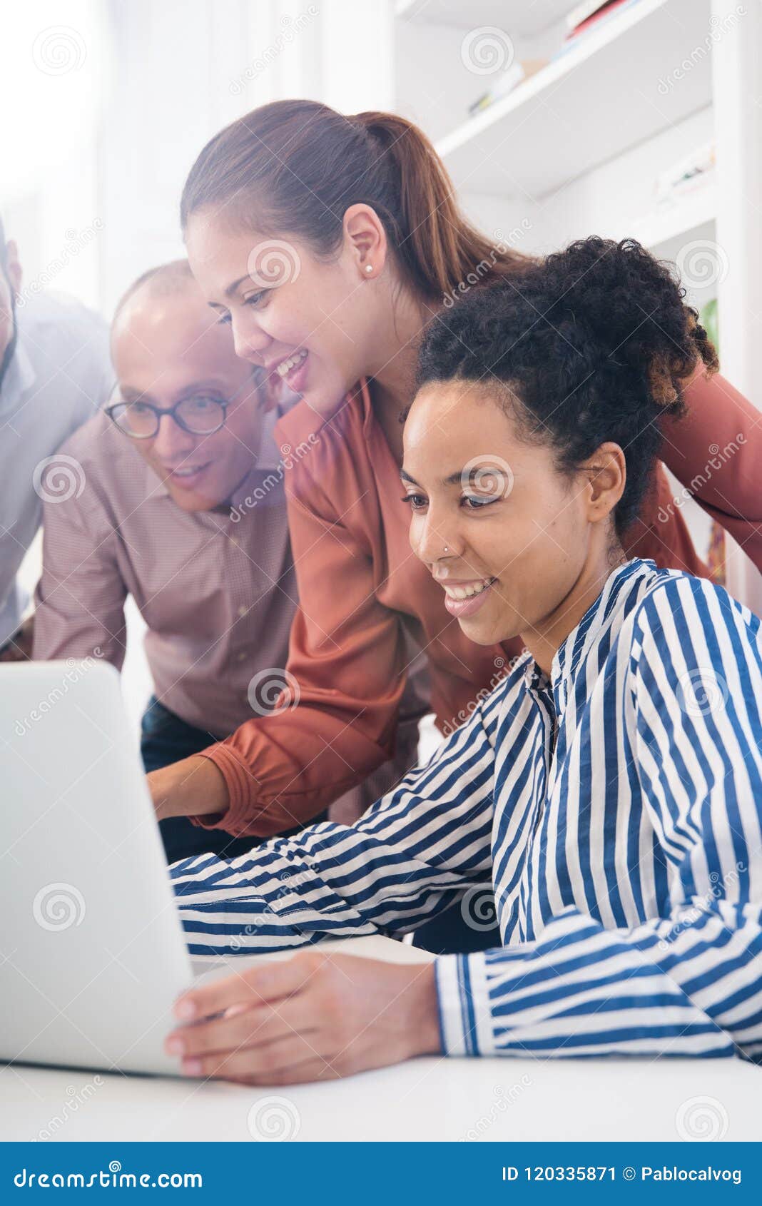 Three Business People Around a Laptop Stock Image - Image of black ...
