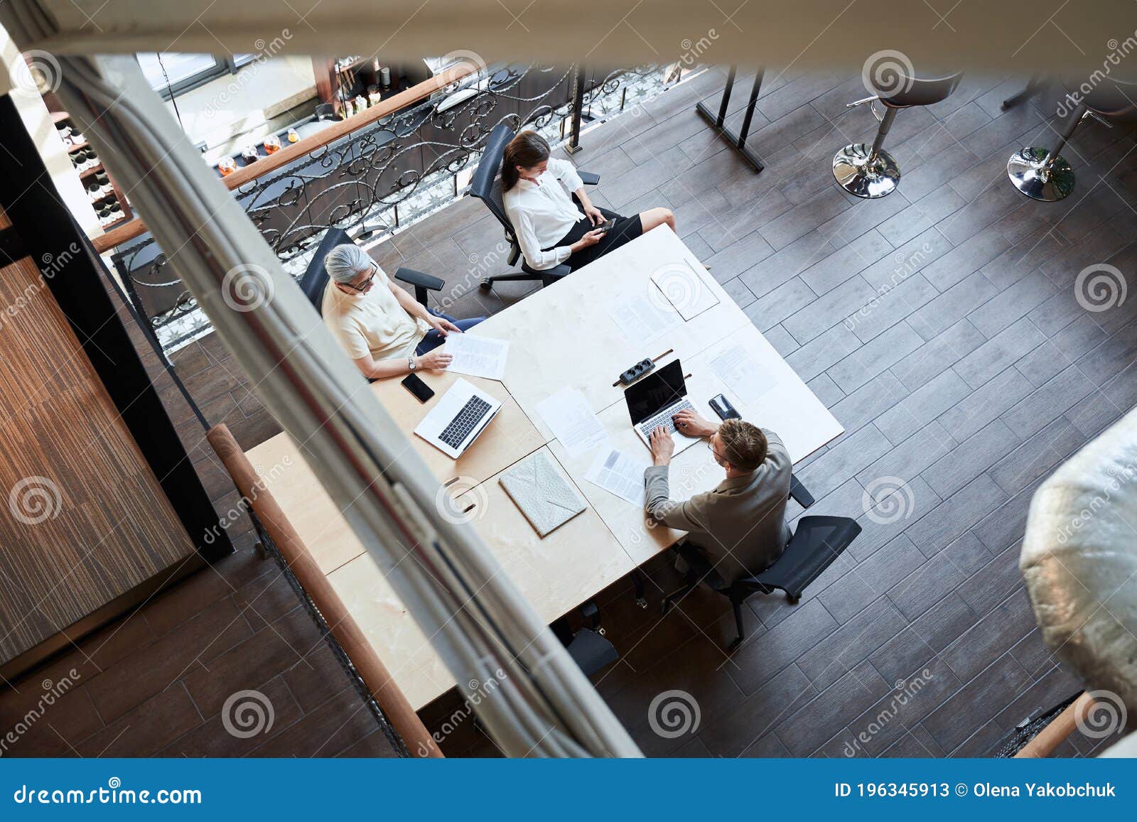 Three Business People Sharing a Working Space Stock Image - Image of ...