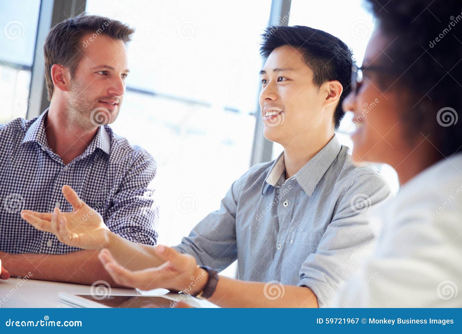 Three Business Professionals Working Together Stock Image - Image of ...