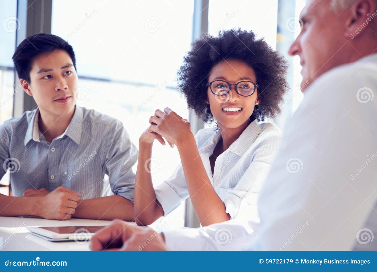 Three Business Professionals Working Together Stock Image - Image of ...