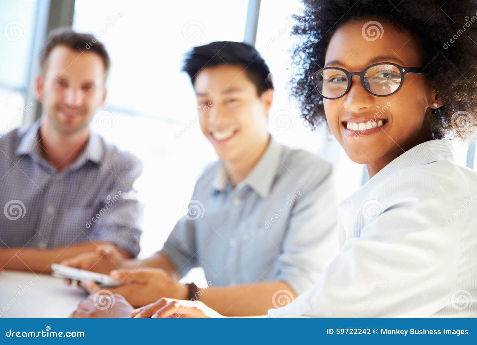 Three Business Professionals Working Together Stock Photo - Image of ...