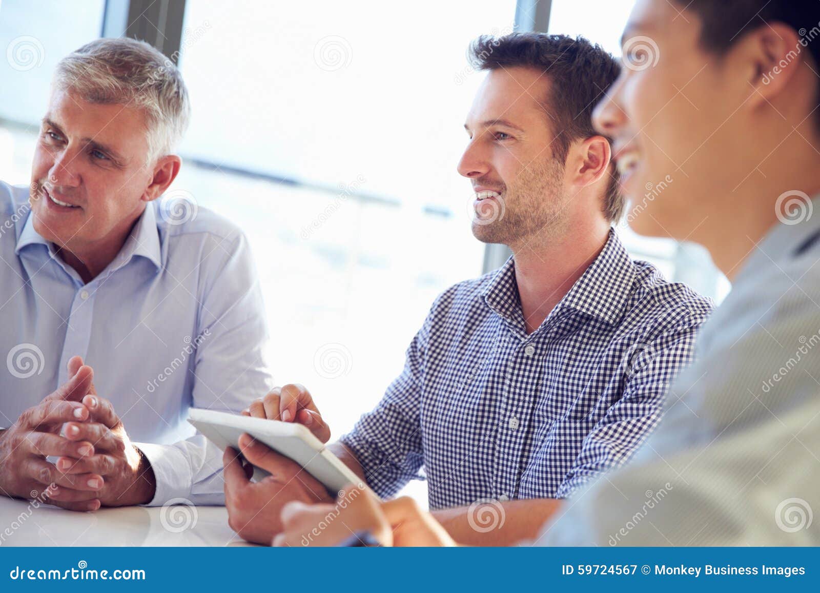 Three Business Professionals Working Together Stock Image - Image of ...
