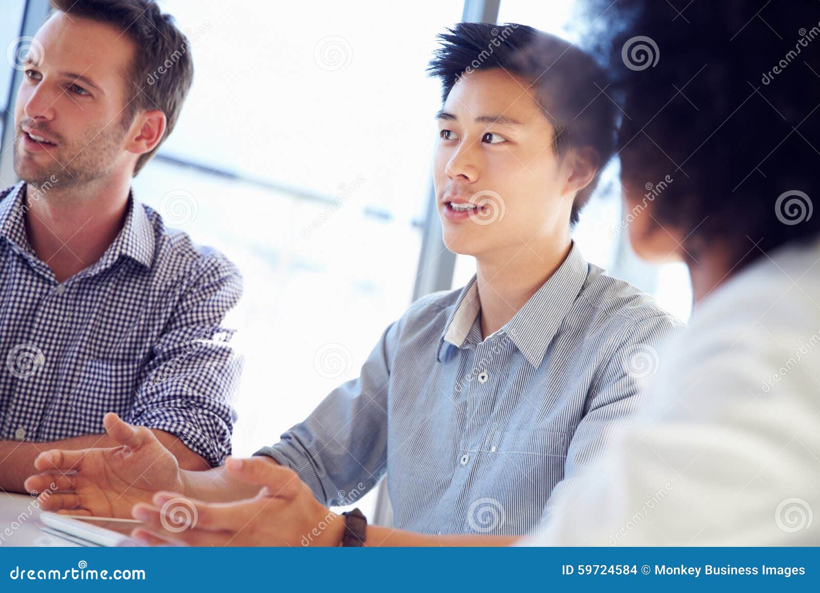 Three Business Professionals Working Together Stock Photo - Image of ...