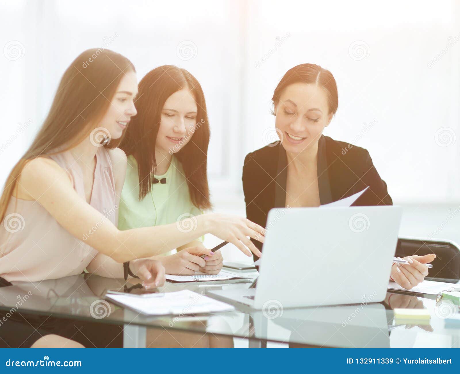 Three Business Women Discussing Work Issues in the Office Stock Image ...