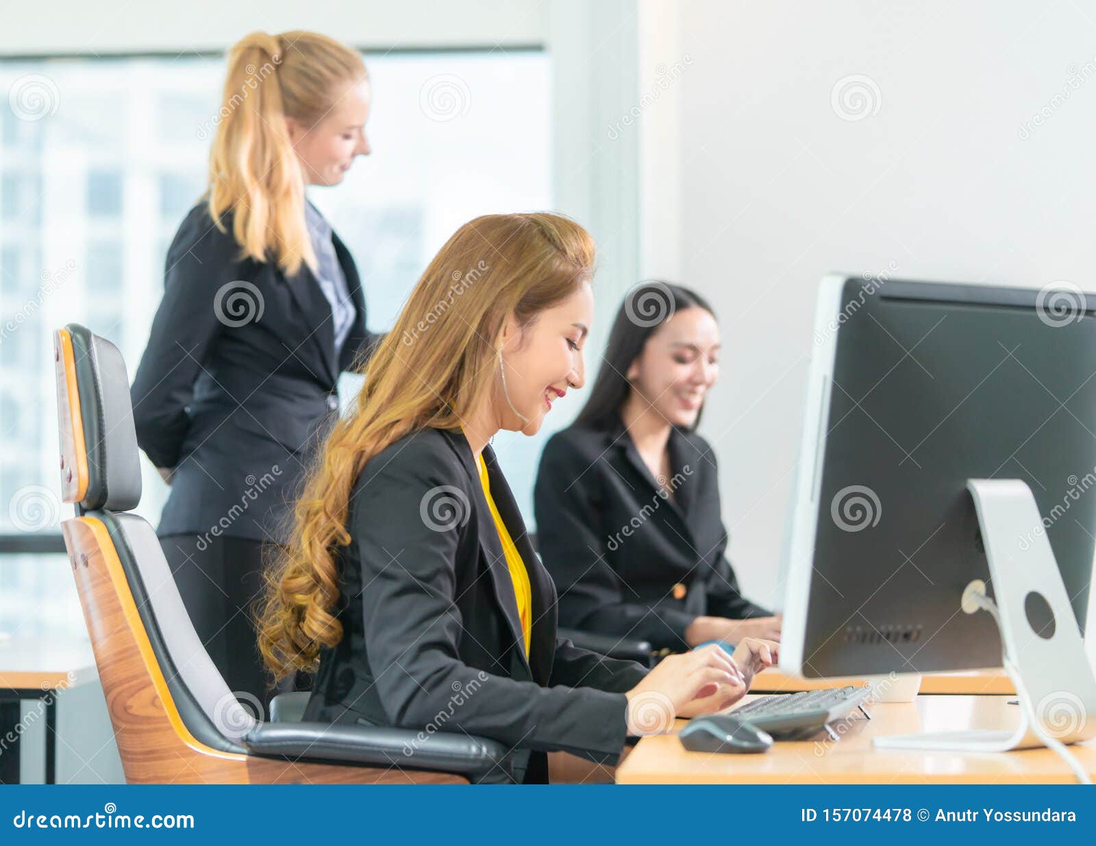 Three Business Women Working Happily in Modern Business Office Stock ...