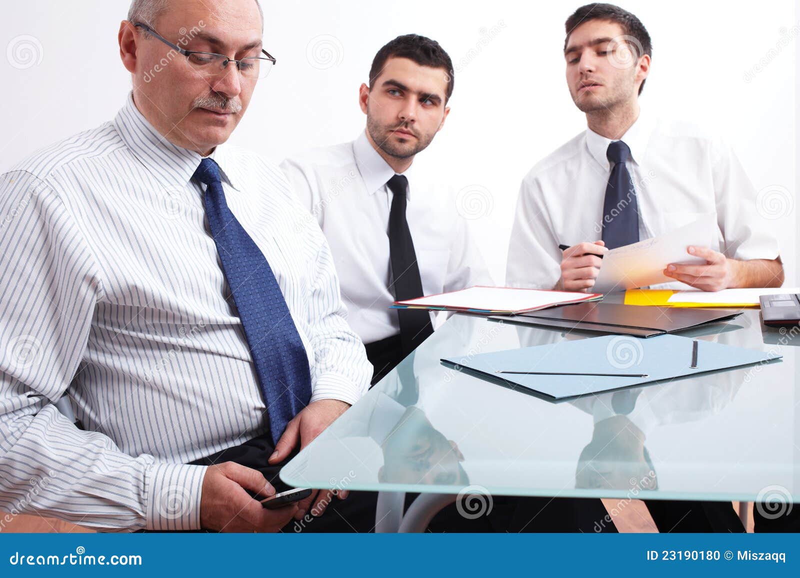 Three Businessman Sitting at Table during Meeting Stock Photo - Image ...