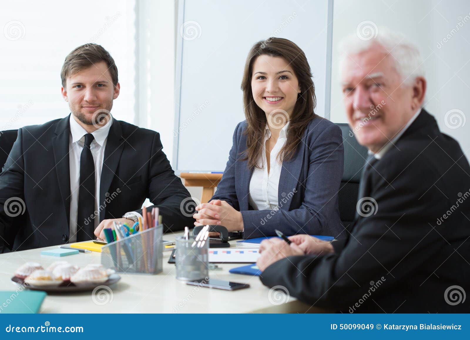 Three businesspeople stock image. Image of meeting, busy - 50099049