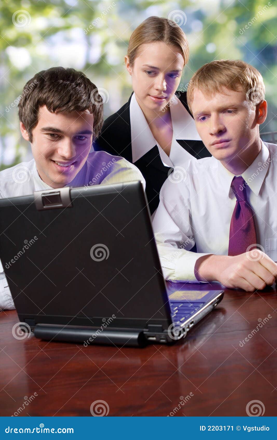 Three Businesspeople on Laptop Stock Image - Image of people, female ...