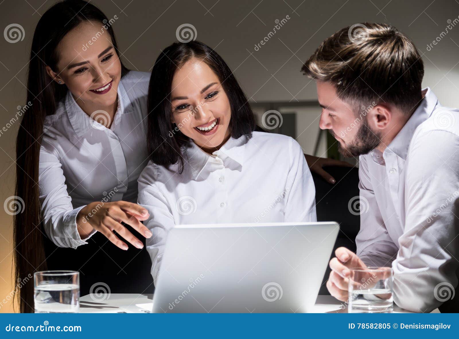 Three Businesspeople Looking at Computer Screen Stock Image - Image of ...