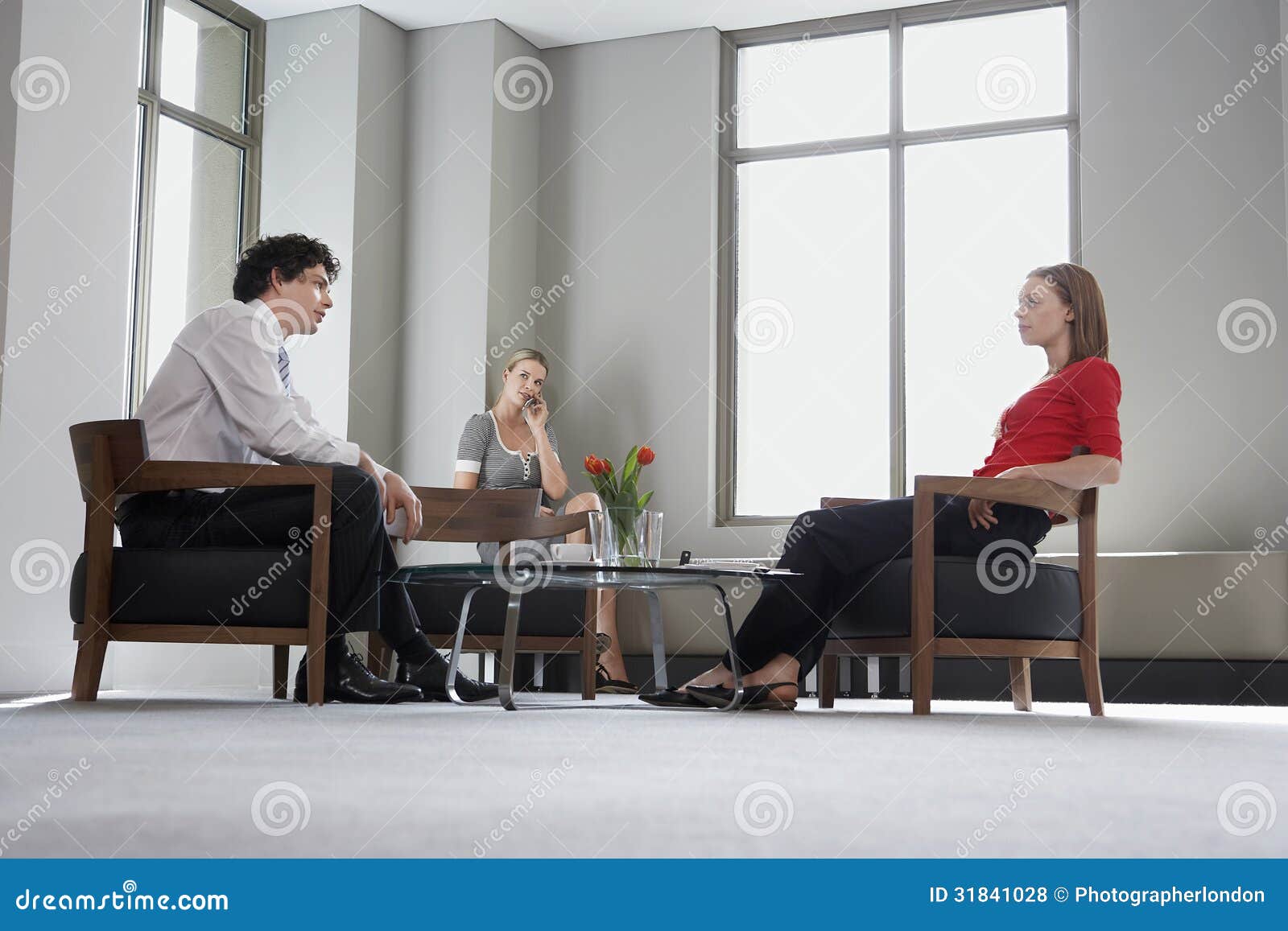 Three Businesspeople in Meeting Stock Photo - Image of meeting ...