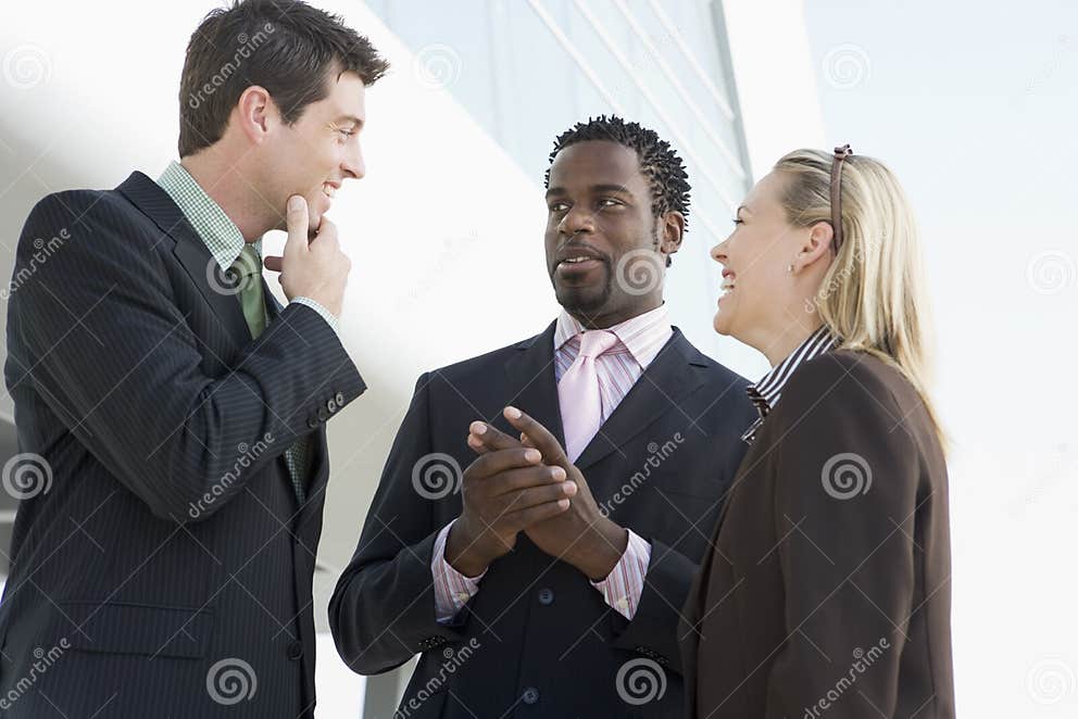 Three Businesspeople Standing Outdoors by Building Stock Image - Image ...
