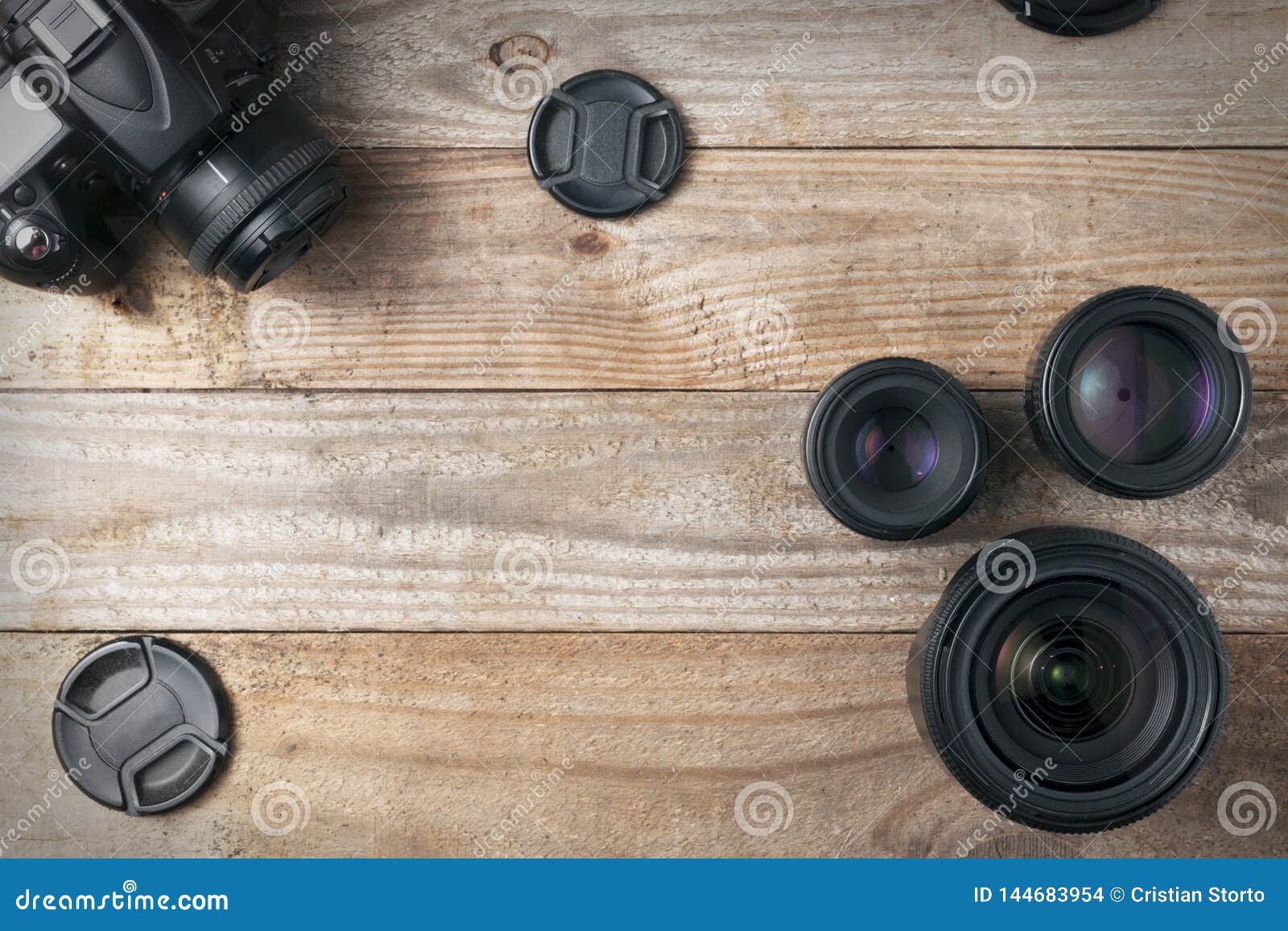 Three Camera Lenses and a Dslr Digital Camera on a Wooden Table, Top ...