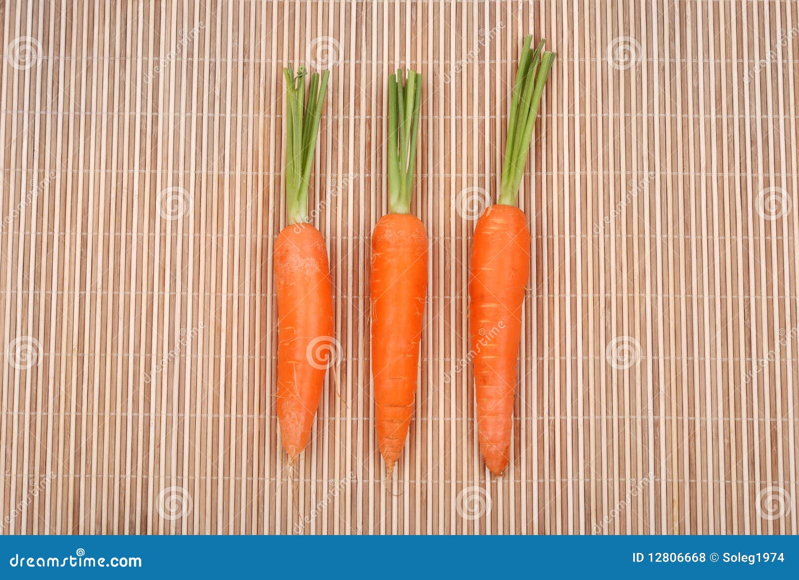 Three carrots on a mat stock photo. Image of nutrition - 12806668