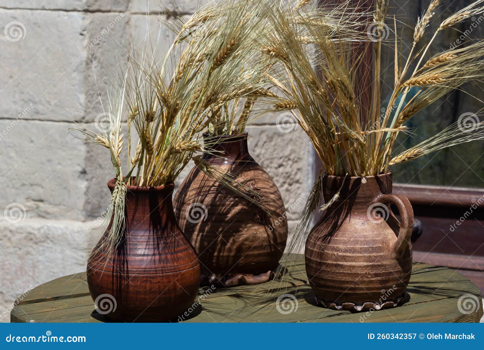 Three Ceramic Pots with Spikelets, Corn Stand on the Windowsill Stock ...