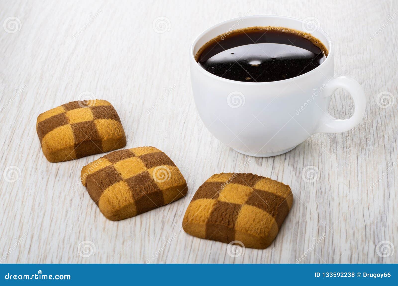 Three Checkered Shortbread Cookies, Cup of Coffee on Table Stock Photo ...