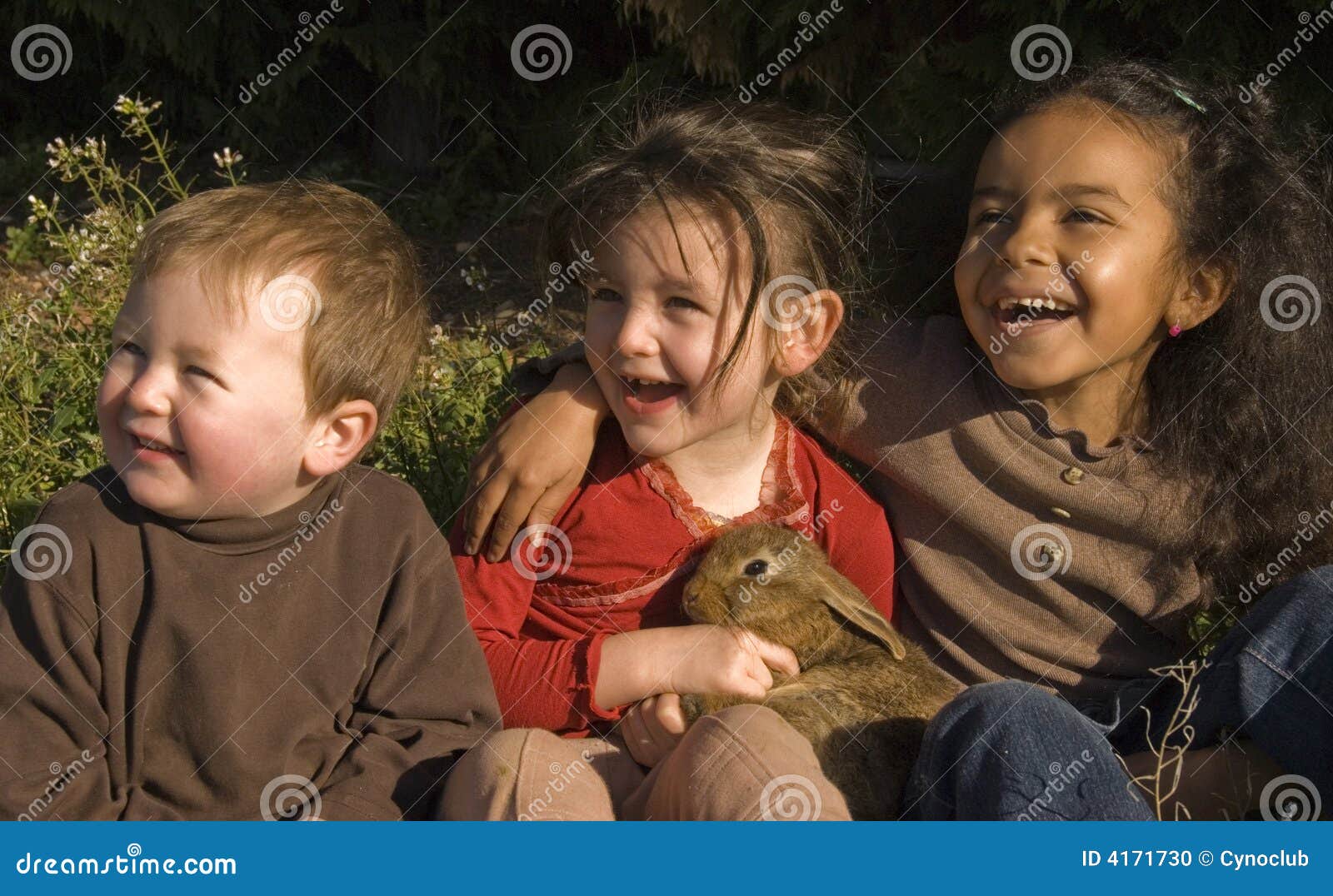 Three children and bunny stock photo. Image of expressive - 4171730